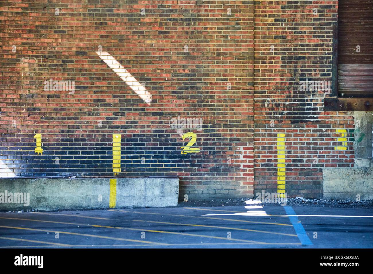 Weathered Brick Wall with Numbered Parking Spaces, Urban Texture Stock ...