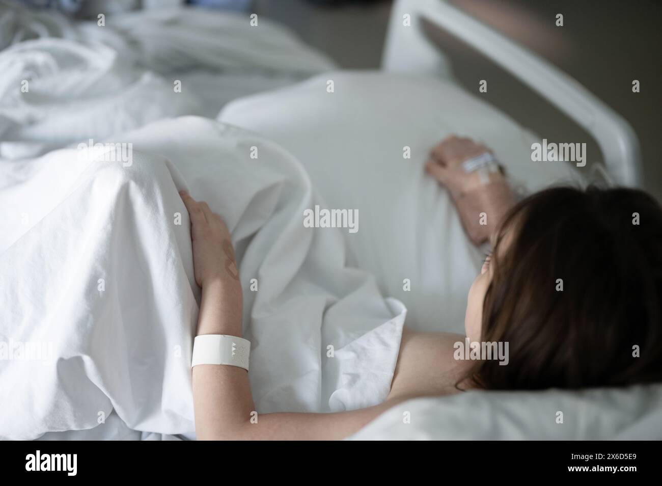 Sick child in hospital bed resting while recovering Stock Photo - Alamy