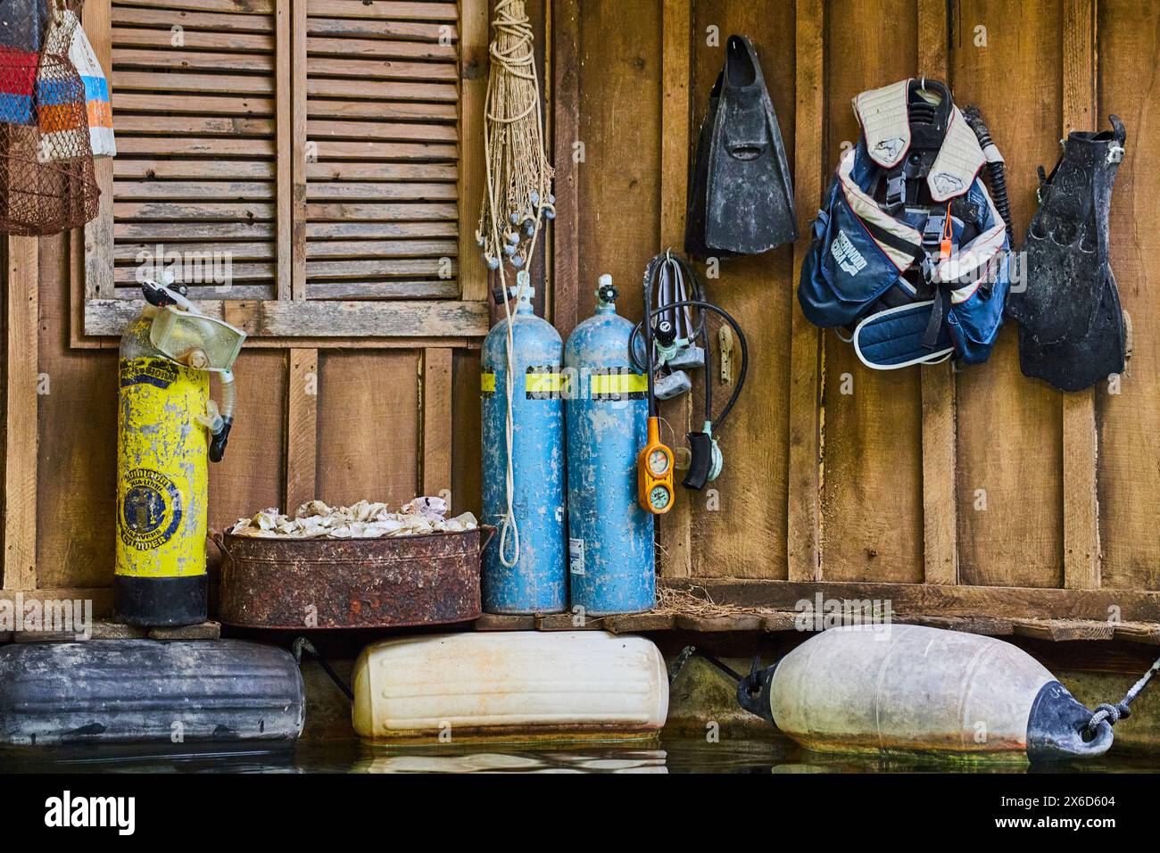 Rustic Diving Gear Display on Wooden Wall by Water Stock Photo - Alamy