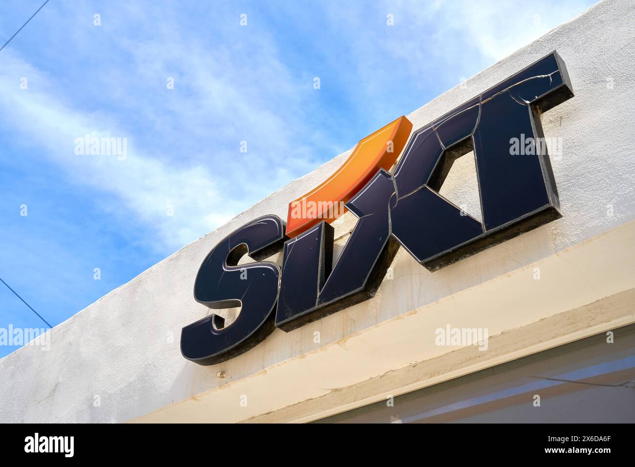 Santorini, Greece - 8 May 2024: SIXT car rental company logo on a ...
