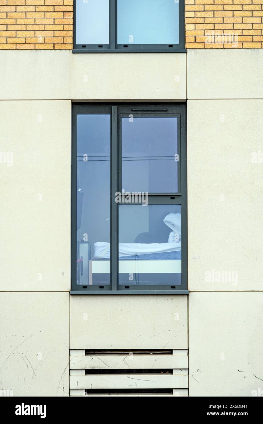 Looking in through a bedroom window in a modern apartment Stock Photo ...