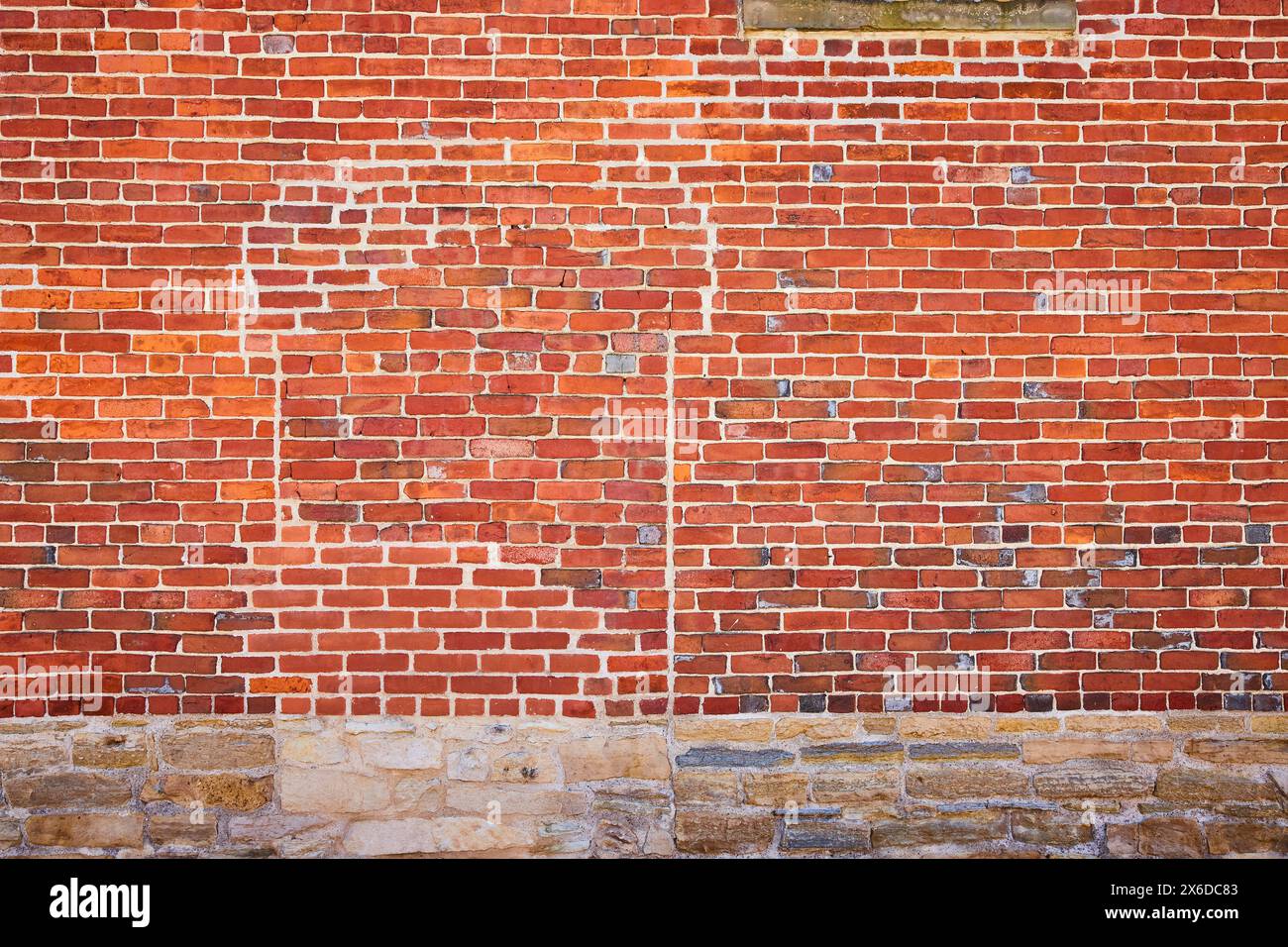 Textured Red Brick Wall with Covered Passage and Stone Foundation, Eye ...