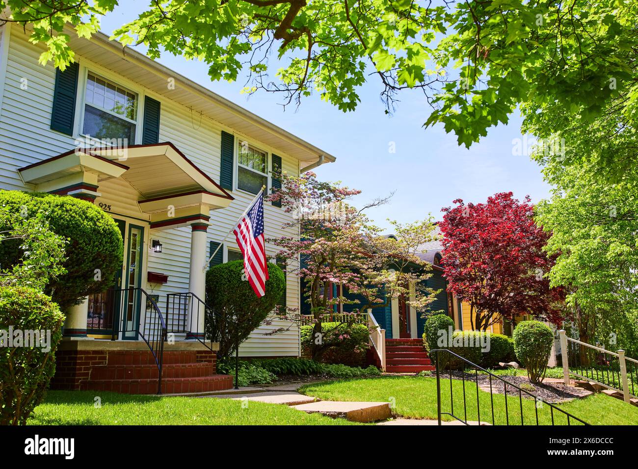Idyllic Suburban Home with American Flag, Eye-Level View Stock Photo ...