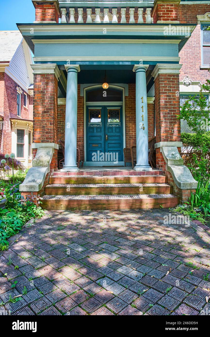 Classic Brick House with Blue Double Doors and White Portico, Welcoming ...