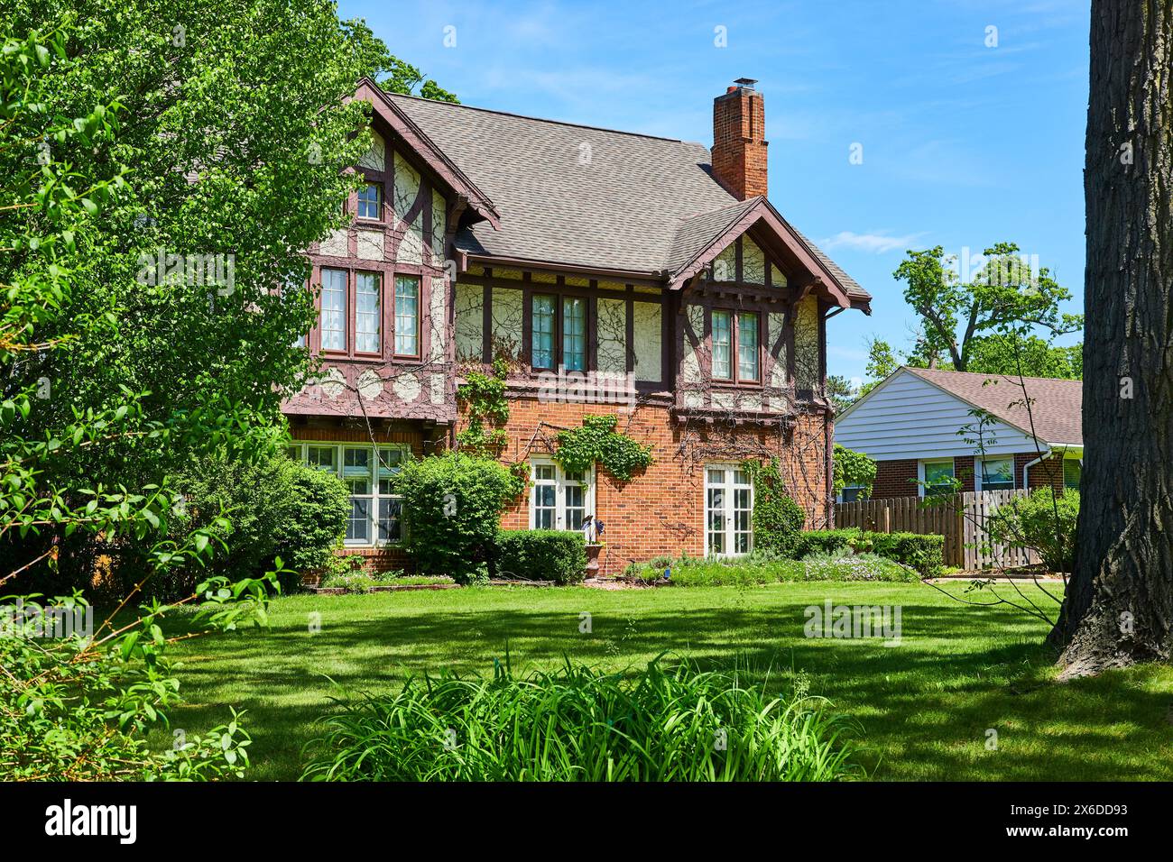Tudor Style House in Lush Suburban Setting, Low Angle View Stock Photo ...
