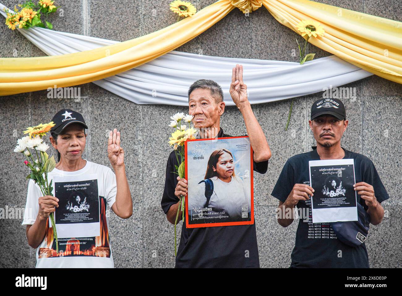 Bangkok, Thailand. 14th May, 2024. Pro-democracy activists make three finger salute and hold ...