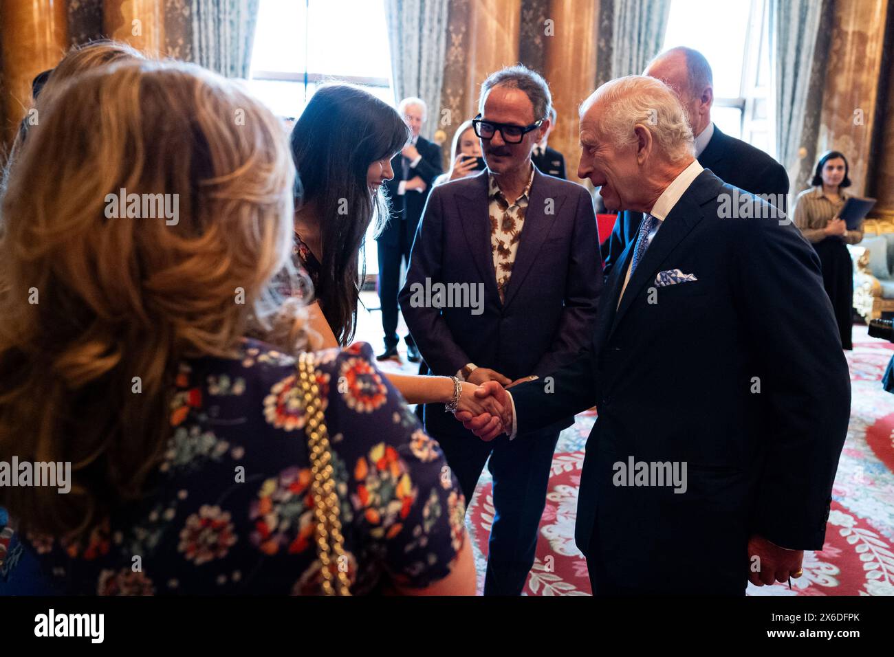 King Charles III greets artist Jonathan Yeo family at the unveiling of ...