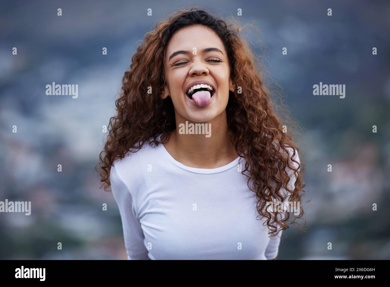 Funny, face and fitness woman with tongue out in nature for training, exercise or cardio break ...