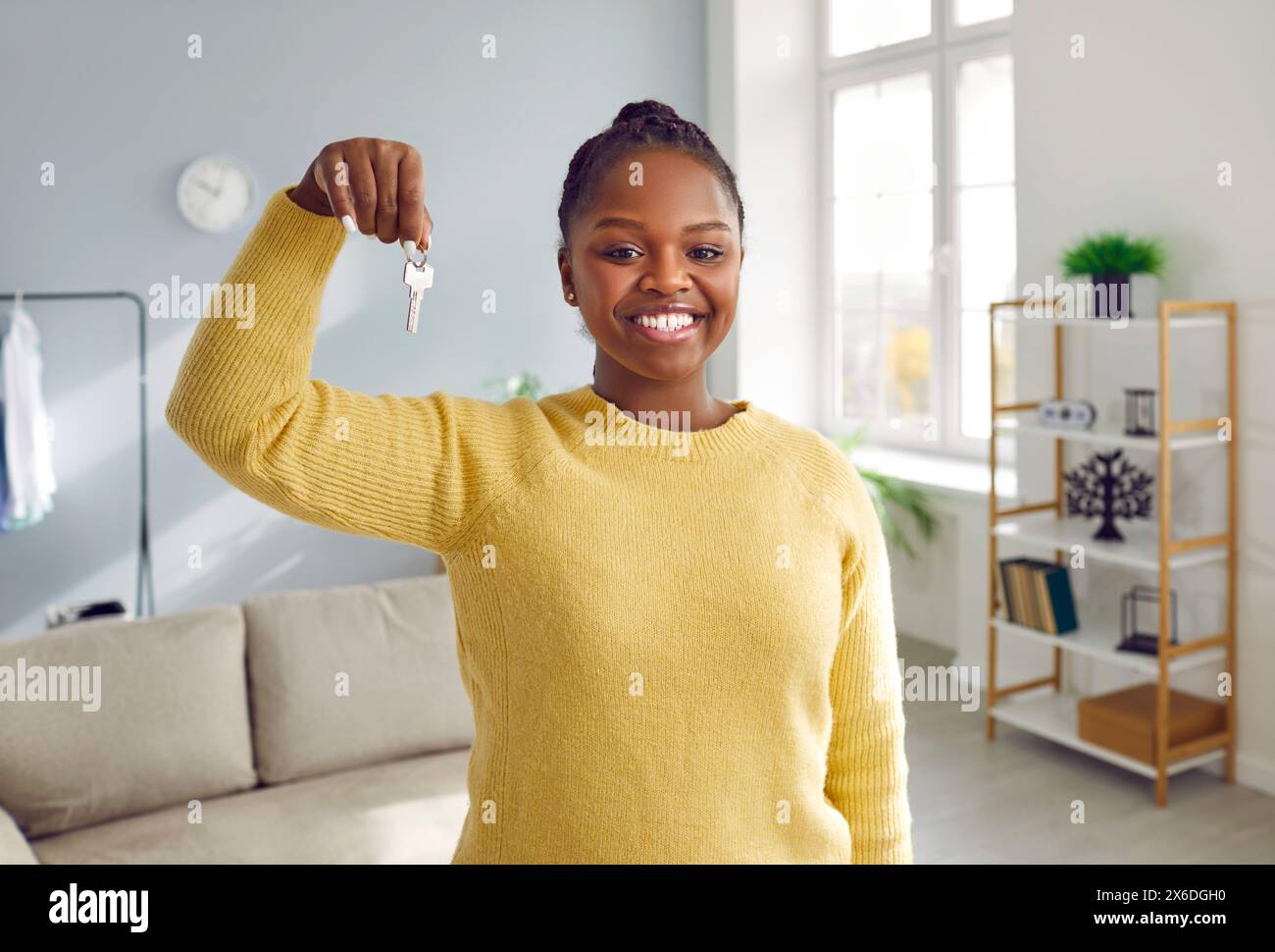 Excited young woman tenant renter showing key to new apartment Stock ...