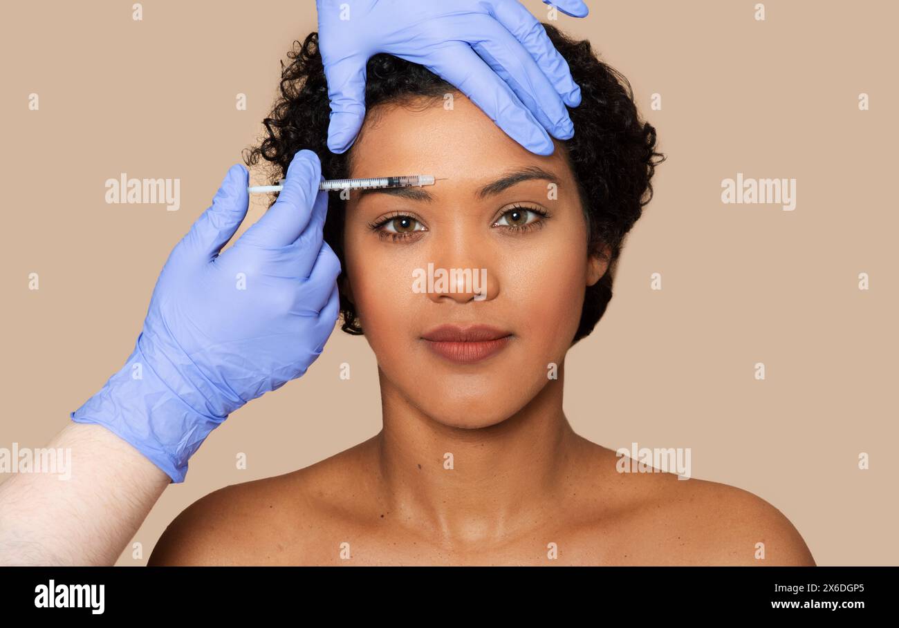 Woman Receiving Filler Injection on Forehead, Closeup Stock Photo - Alamy