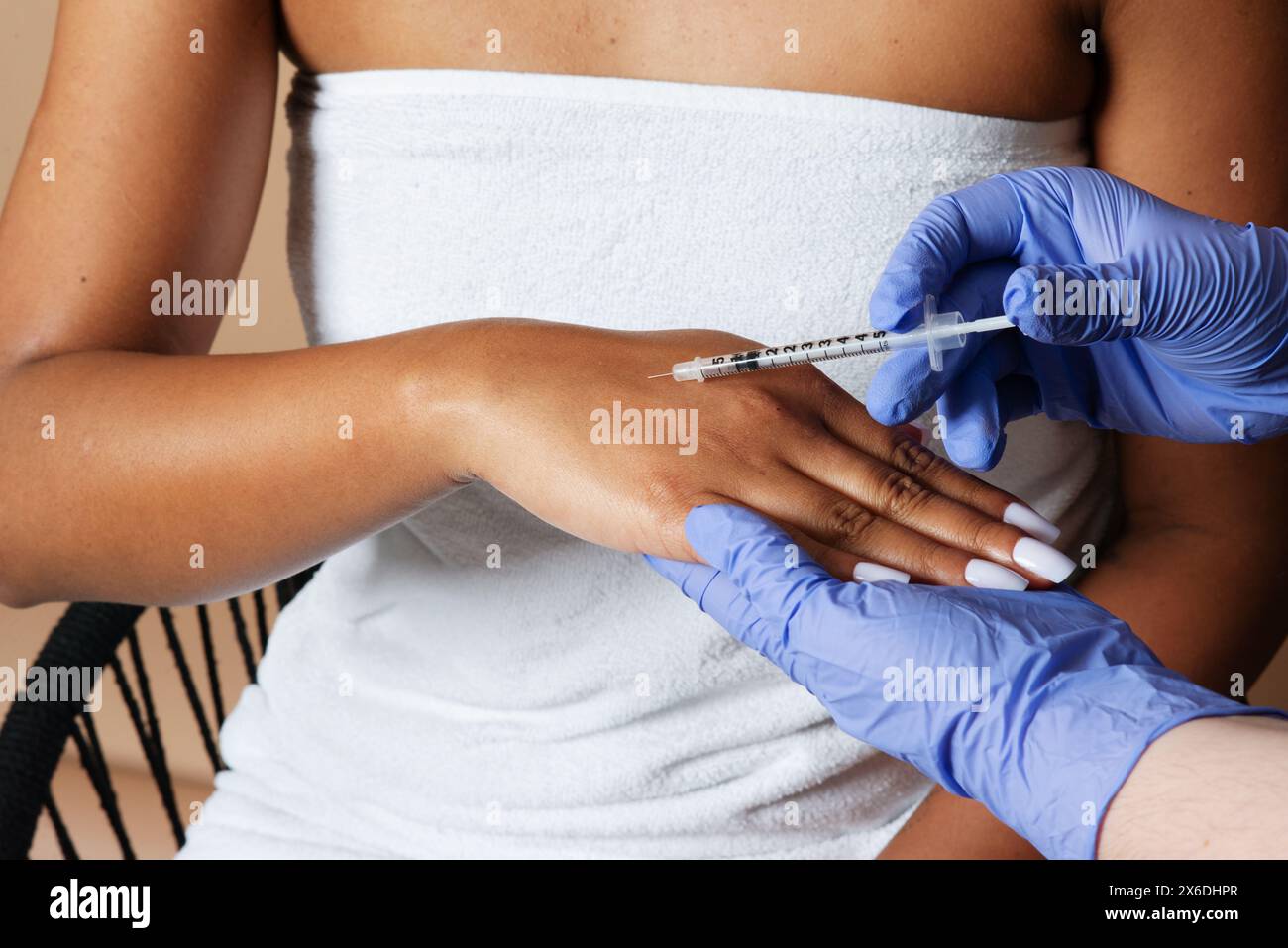 Woman Receiving Syringe Injection in Hand, Cropped Stock Photo - Alamy