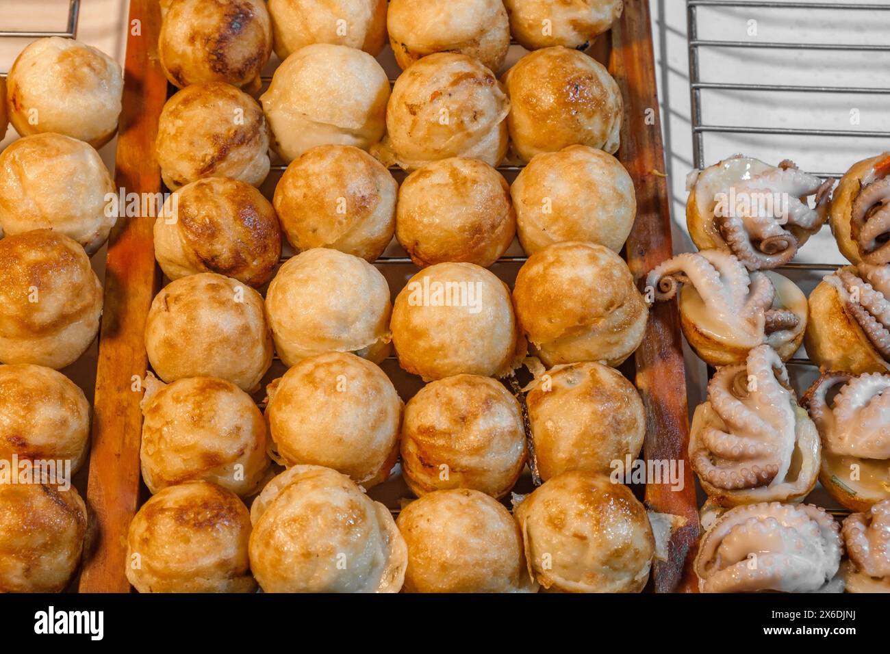 cooked takoyaki grilling, octopuses, snack street food, selective focus ...
