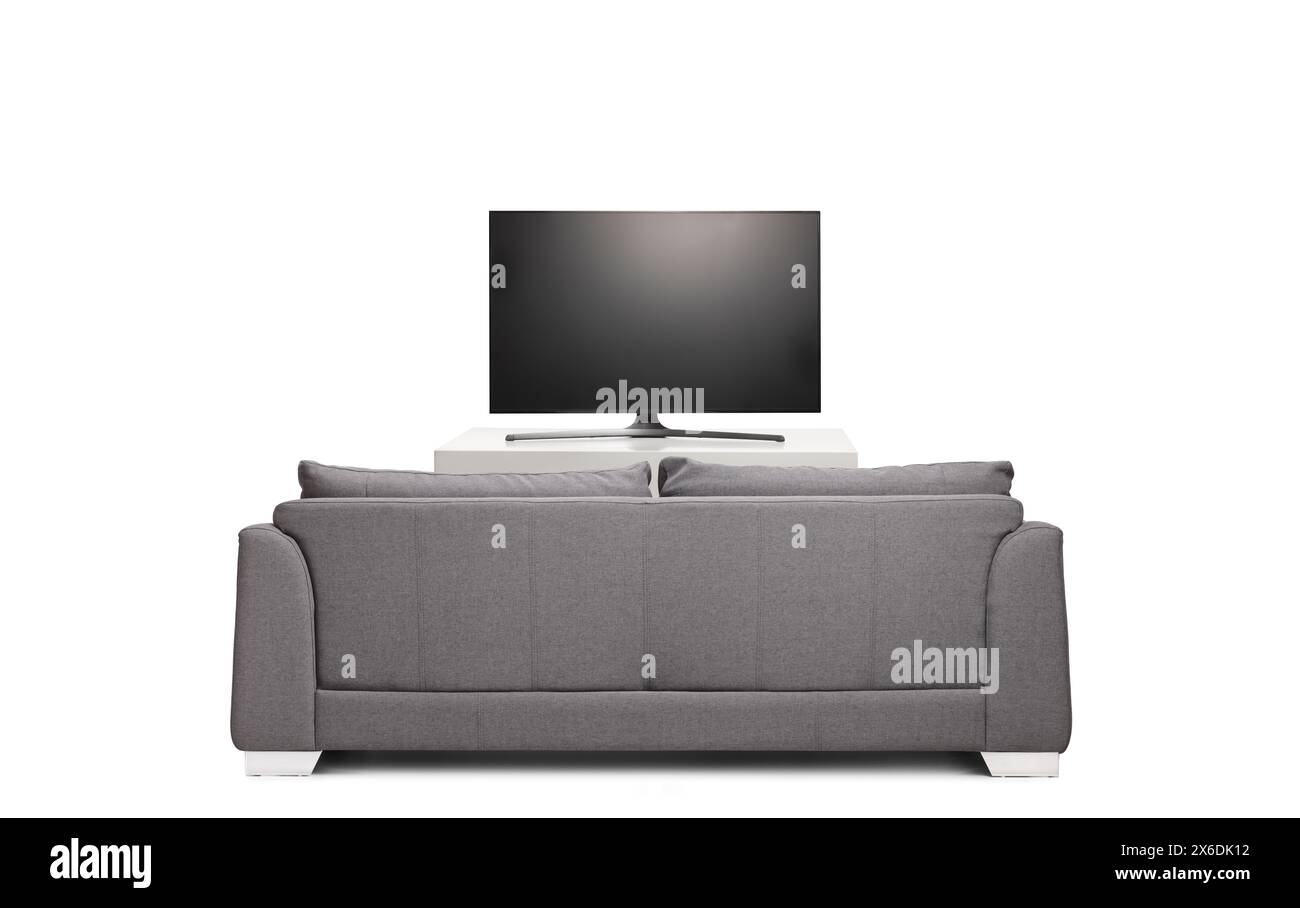 Rear view of a sofa and a tv screen on a stand isolated on white ...