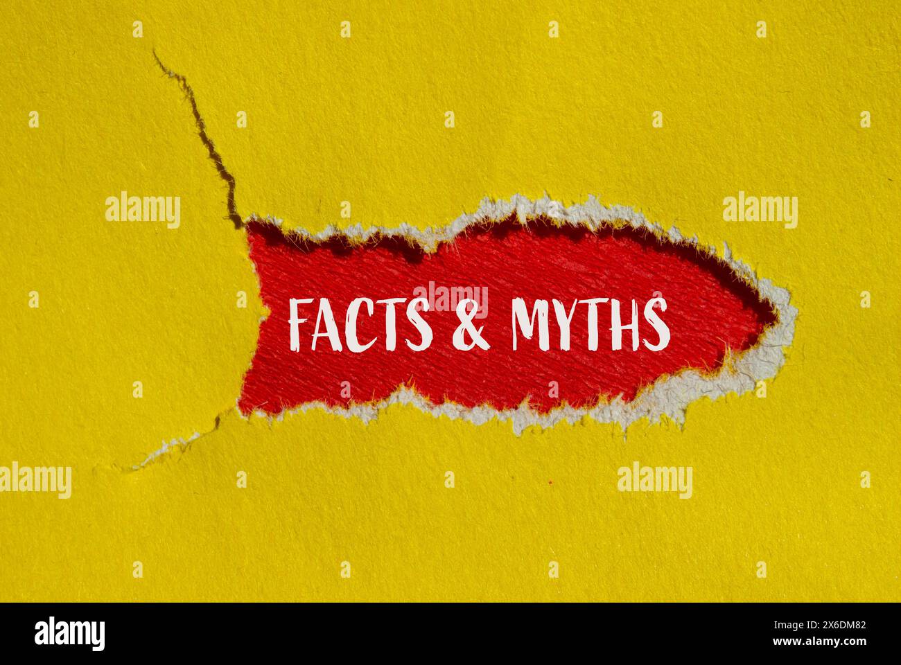 Facts and myths words written on ripped yellow paper with red ...