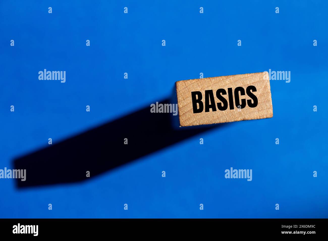 Basics word written on wooden block with blue background. Conceptual ...
