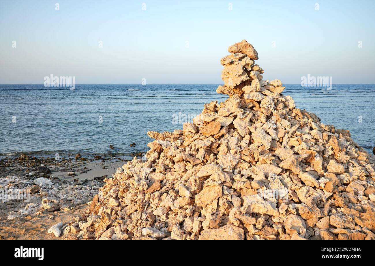 Pyramid of coral and stones on the beach, selective focus, Egypt Stock ...