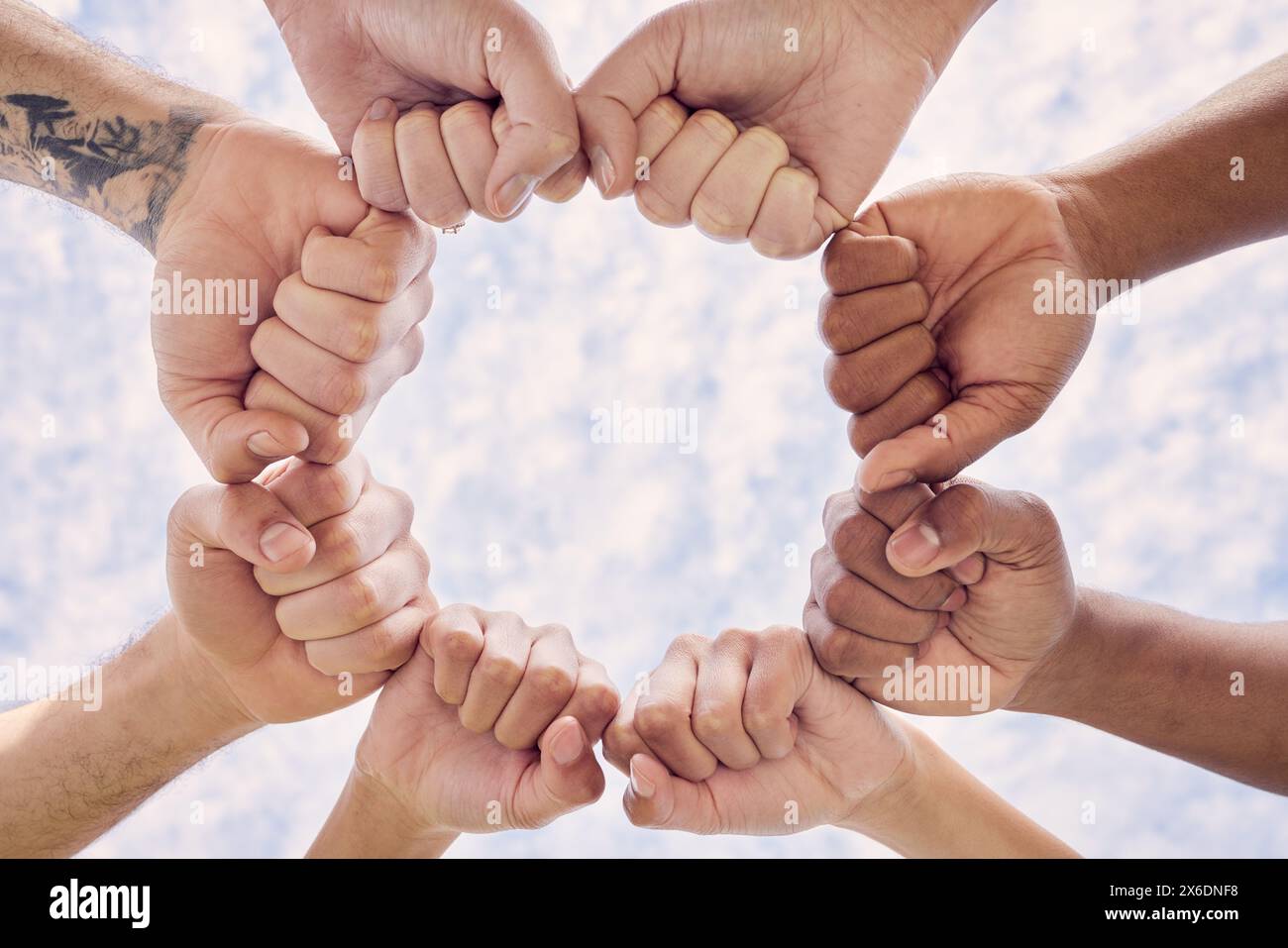 Teamwork, unity and circle with hands for trust with sky for community ...