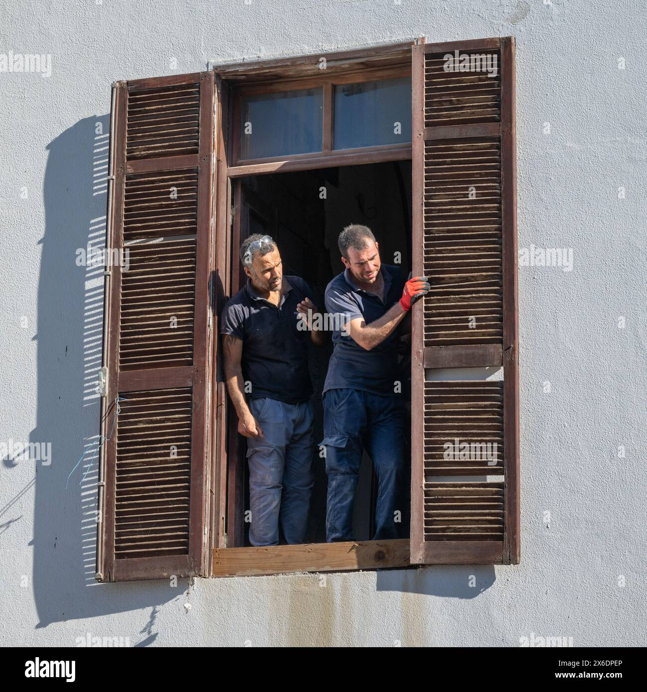 Two men standing in a window hi-res stock photography and images - Alamy