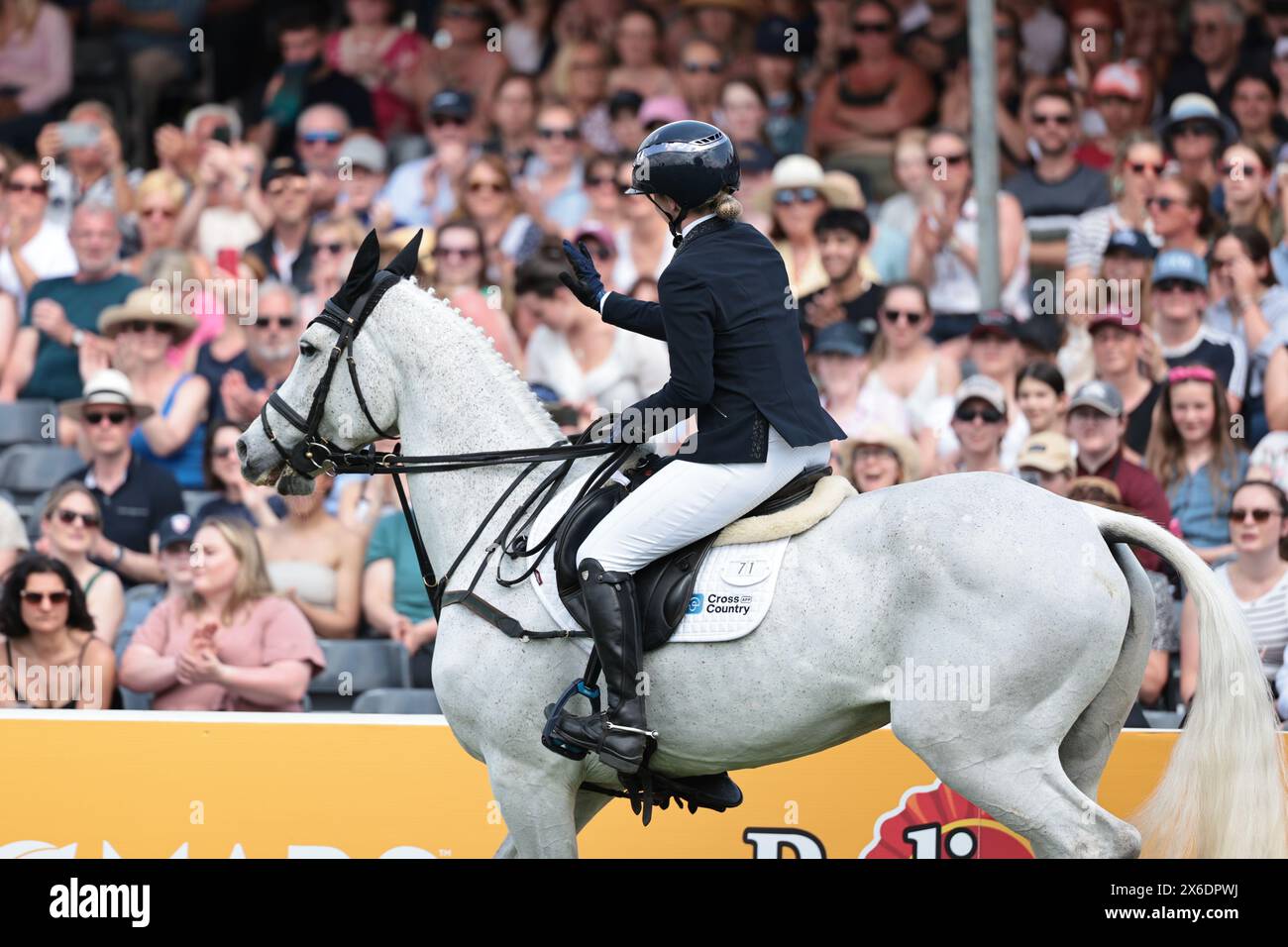 Libby Seed of Great Britain with Heartbreaker Star Quality saluting the public after showjumping ...