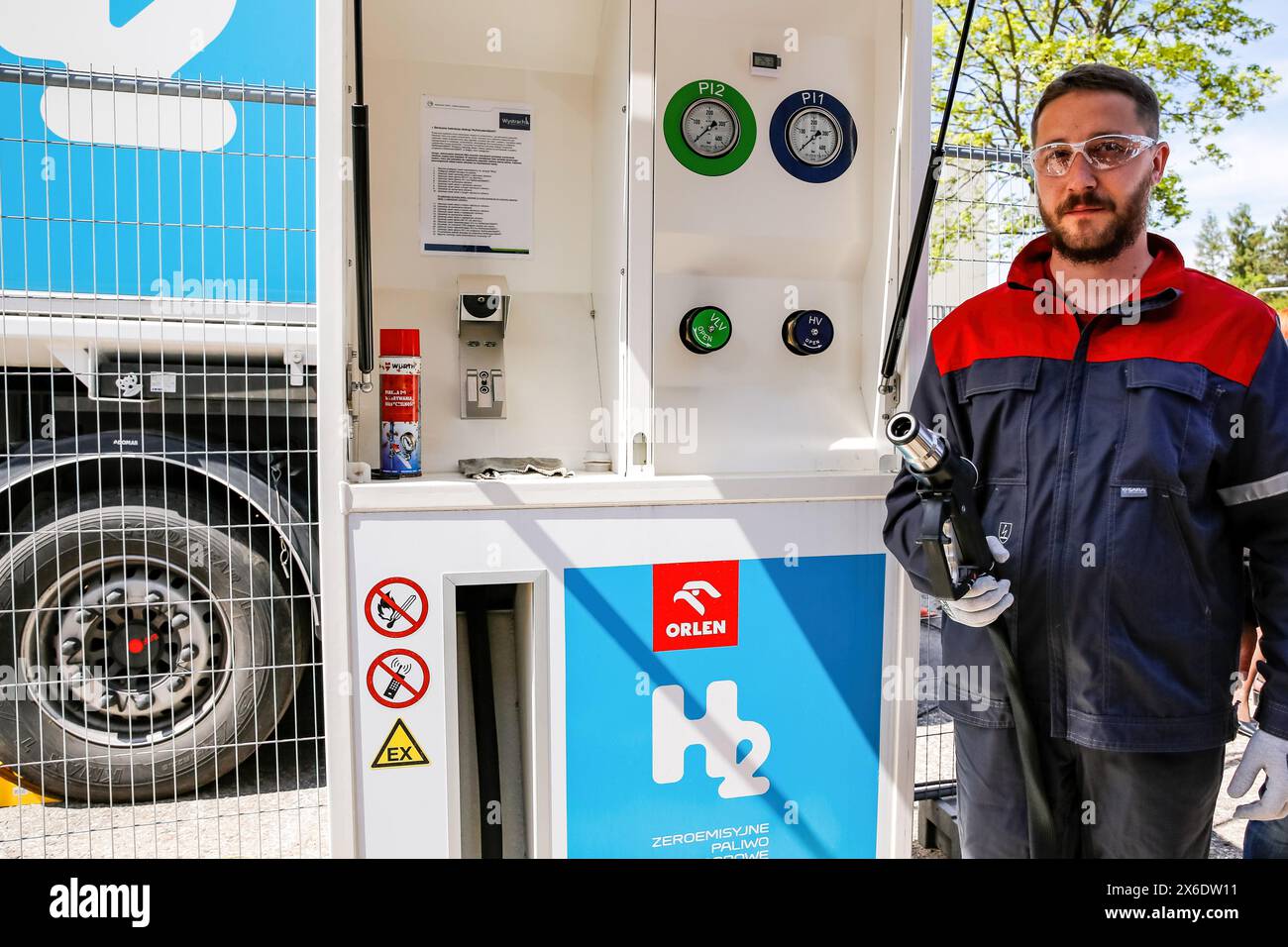 Krakow, Poland. 13th May, 2024. An engineer fuels a hydrogen bus during ...