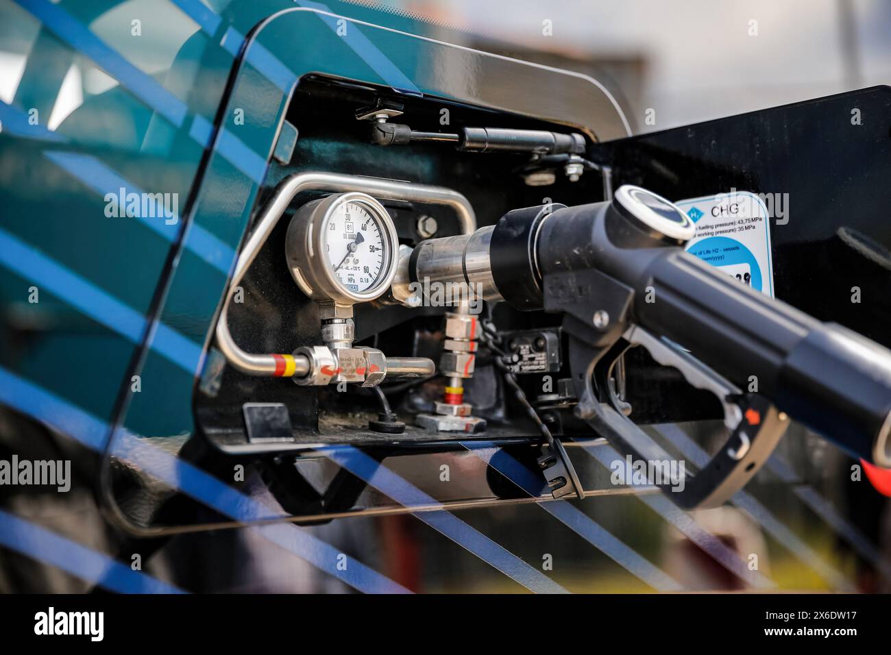 Krakow, Poland. 13th May, 2024. An engineer fuels a hydrogen bus during ...