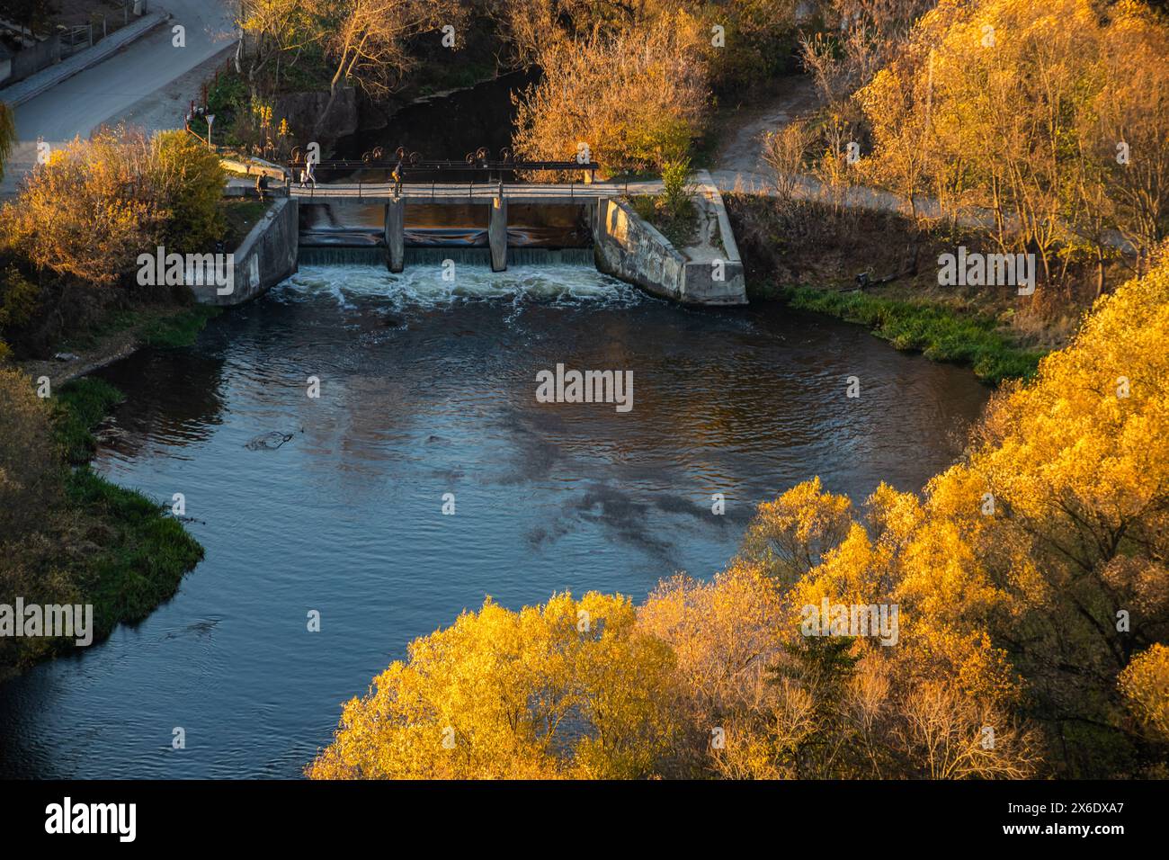 sluices on an old small dam. Autumn landscape, river Stock Photo - Alamy