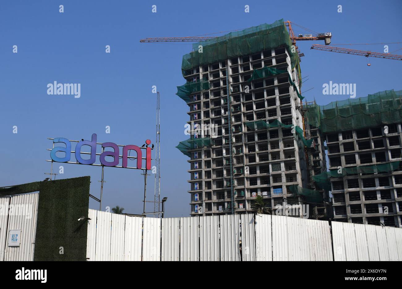 Adani logo is seen near a building construction site in Mumbai. Adani ...