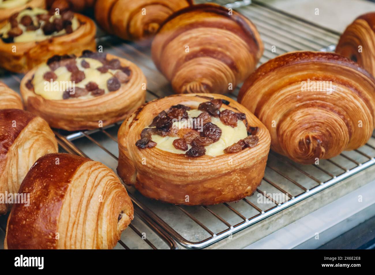 Close-up of fresh and beautiful french pastries in a bakery showcase ...