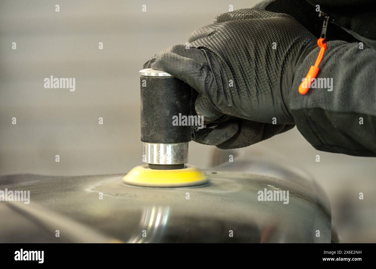 Close-up of auto detailing professional polishing silver car surface ...