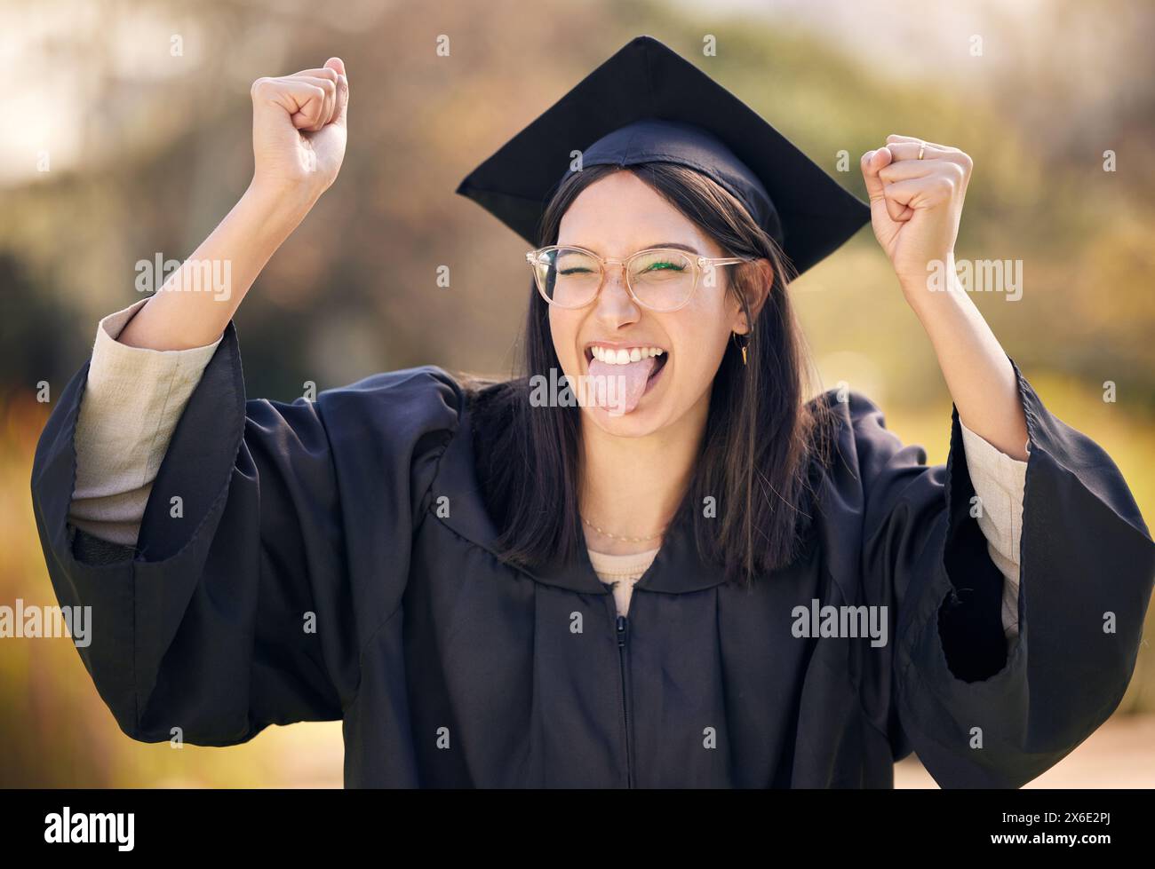 Excited, college portrait and woman for graduation with wink and ...
