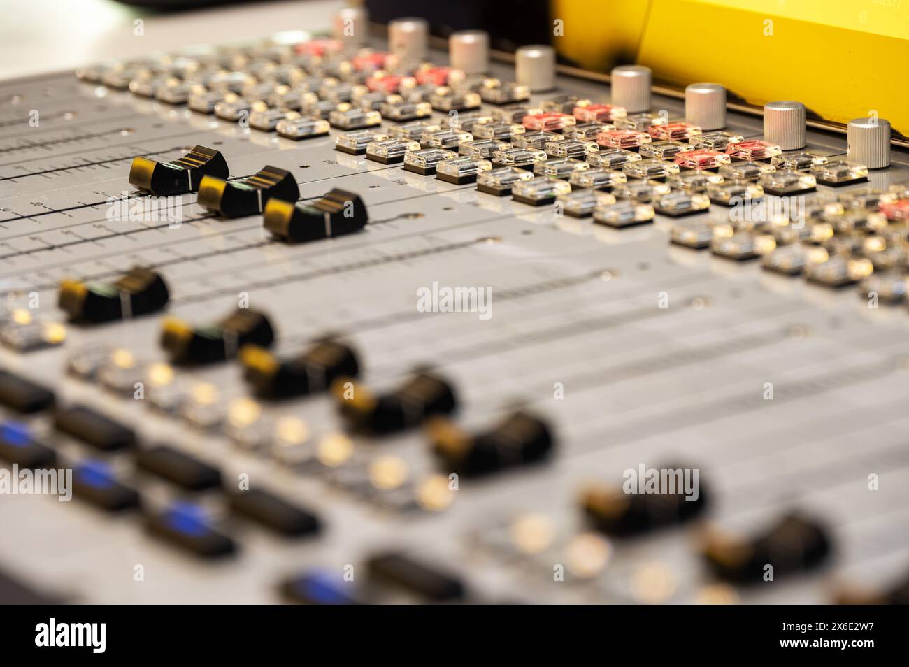 lose-up of a professional mixing console in a recording studio ...