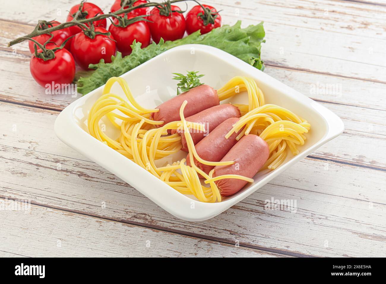 Mini sausages with pasta spaghetti for kids Stock Photo - Alamy