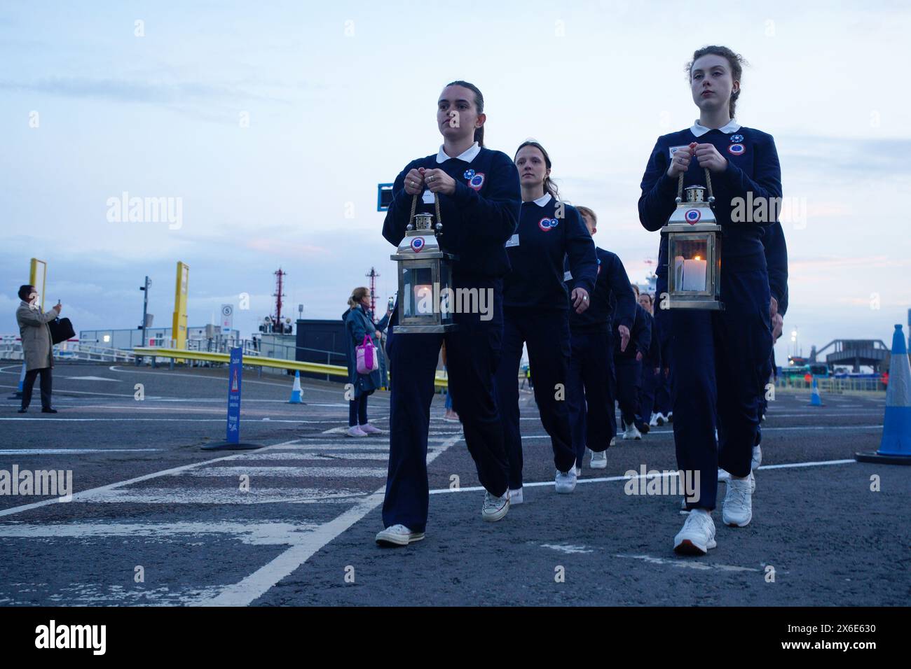 France's Freedom Flame is carried in a procession at Portsmouth International Port. The Flamme ...