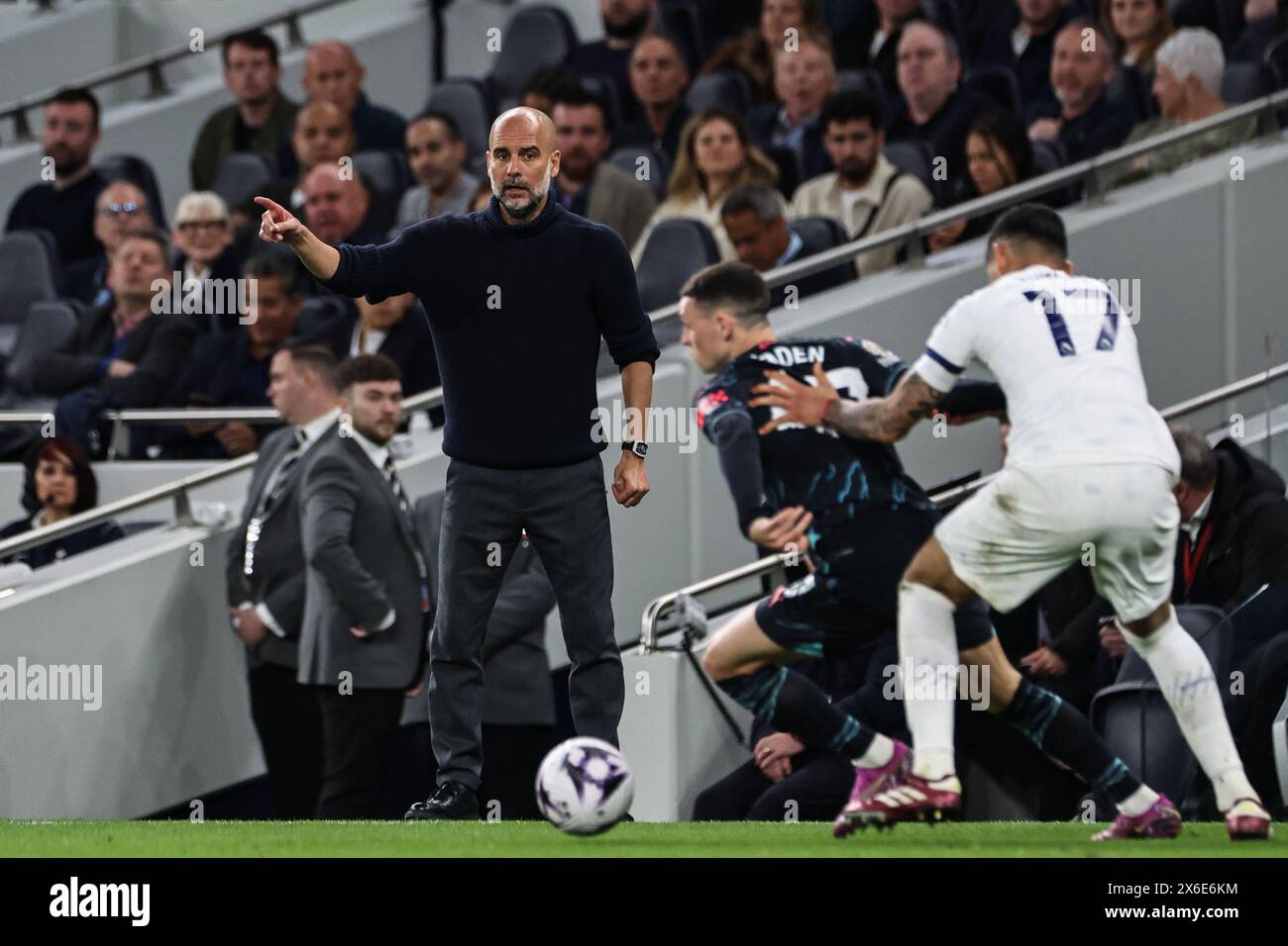Pep Guardiola manager of Manchester City watches on during the Premier ...