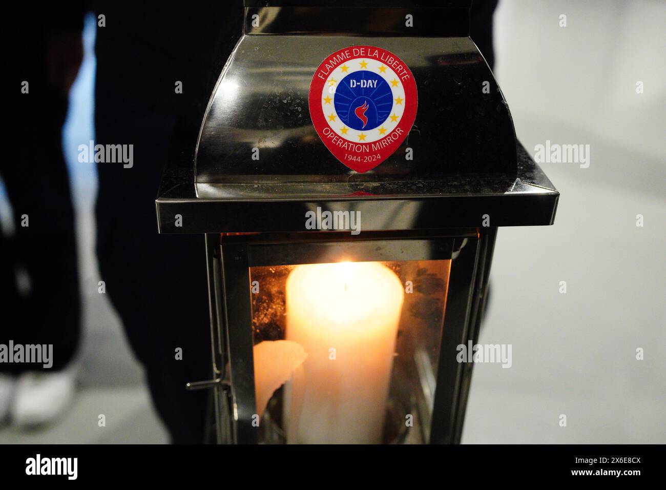 France's Freedom Flame is carried during a ceremony at Portsmouth ...