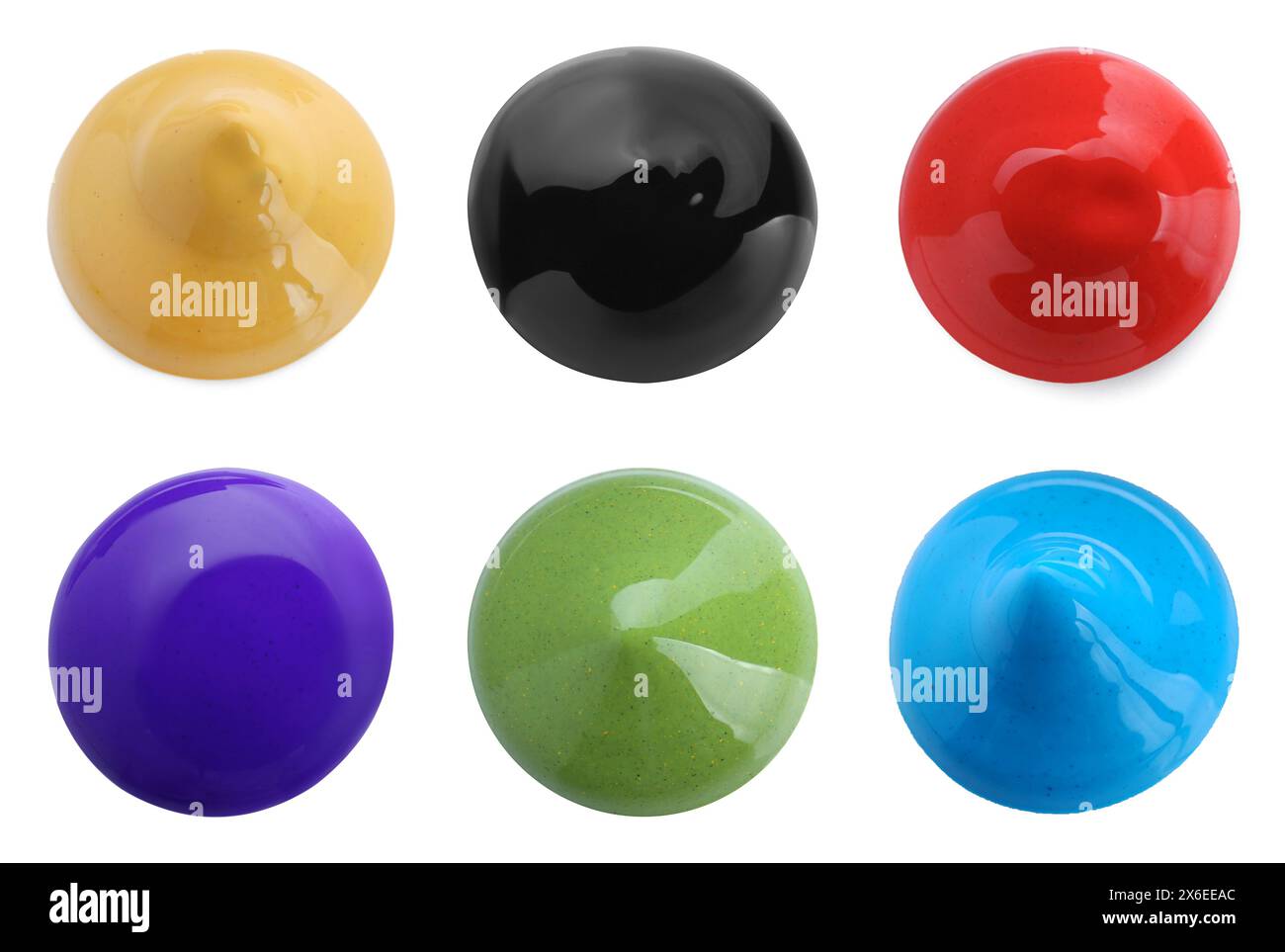 Set with paint blobs of different colors isolated on white, top view ...