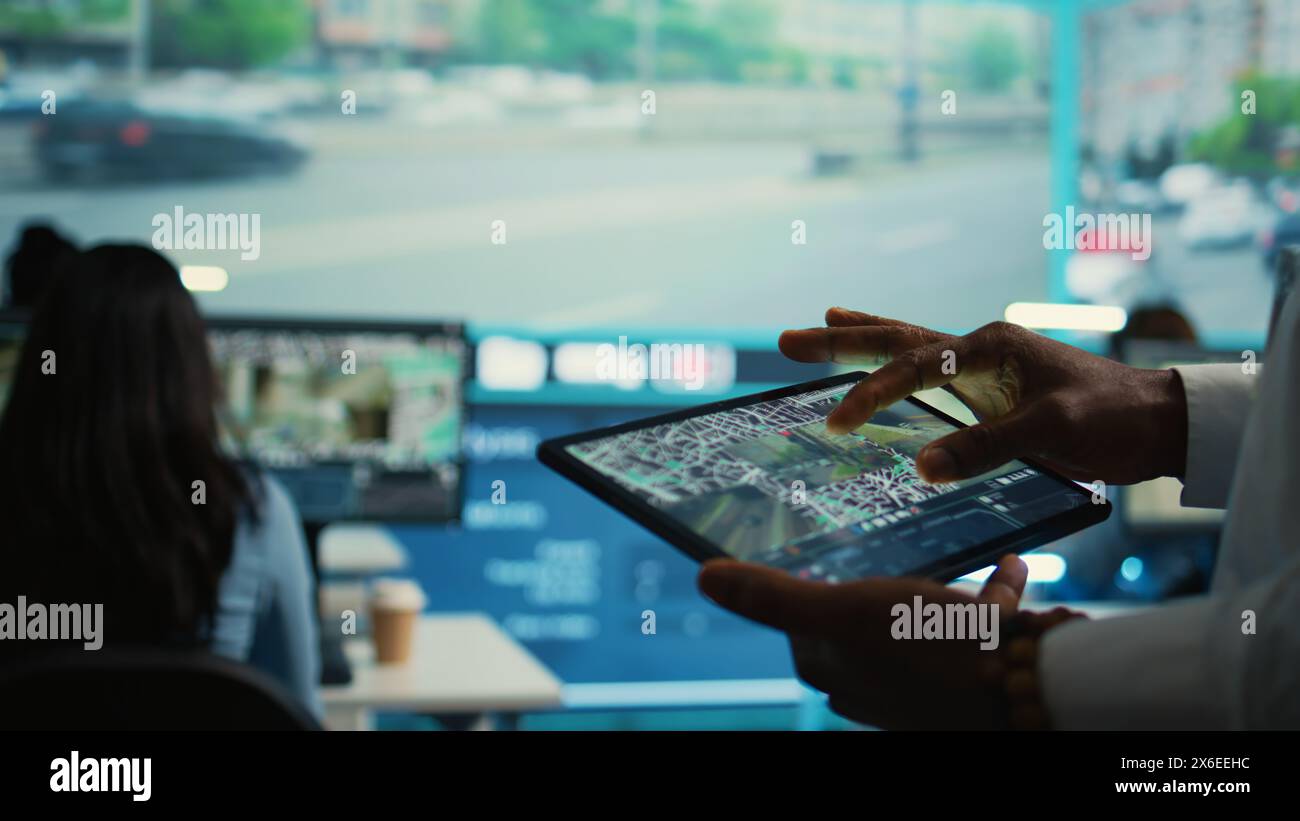 Manager tracking a delivery car by using satellite map for navigating ...