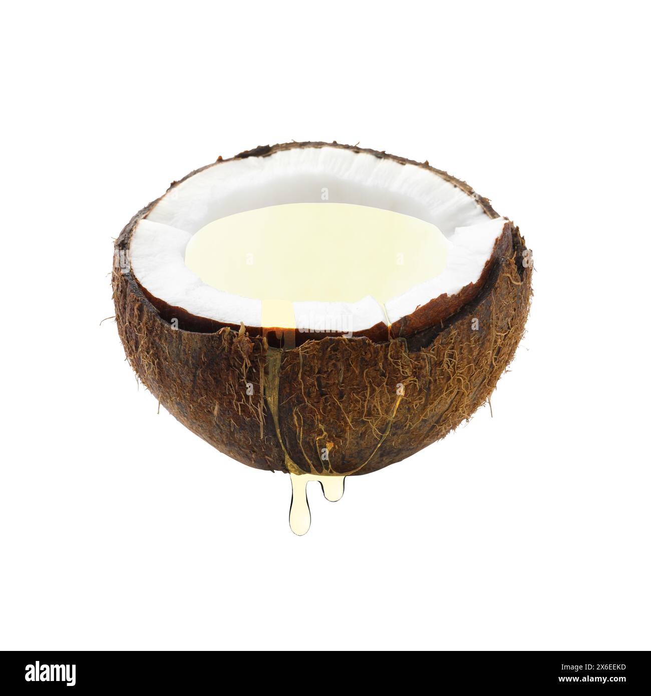 Coconut with dripping oil isolated on white Stock Photo - Alamy