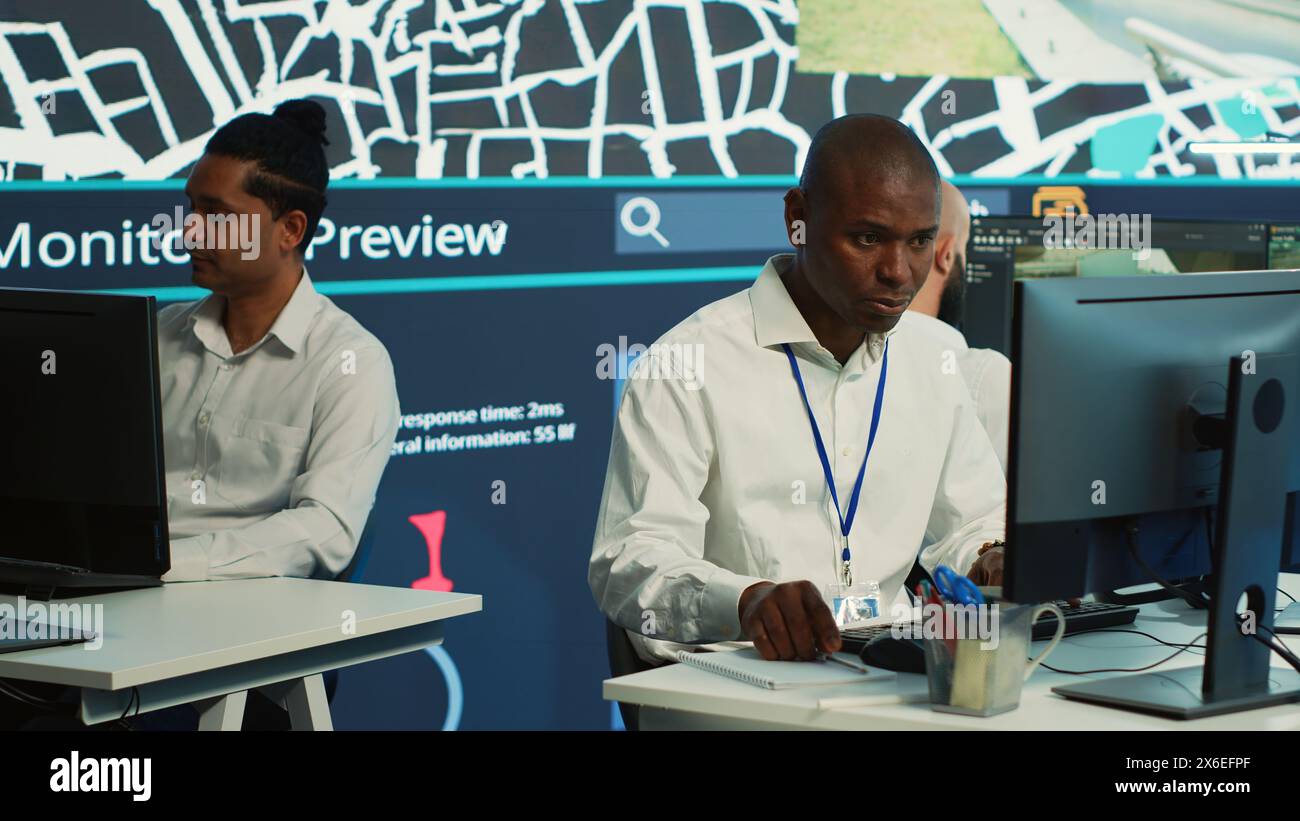 African american agency employee gathers data for order tracking ...