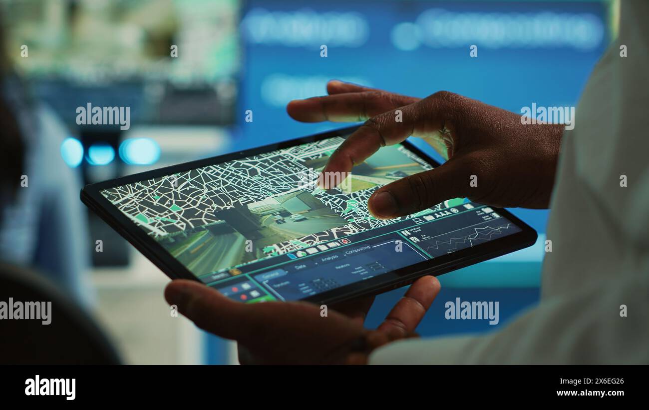 Manager tracking a delivery car by using satellite map for navigating ...