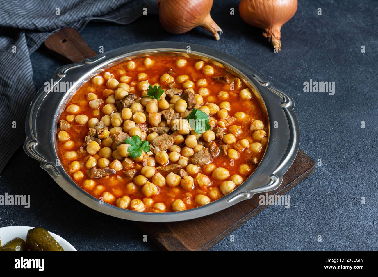 Delicious traditional turkish chickpea dish with meat in metal plate ...