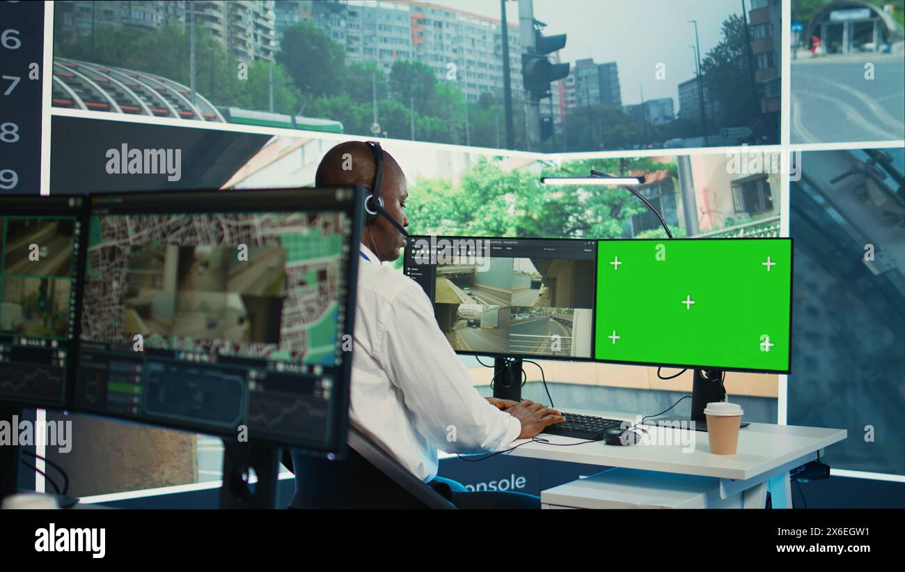 African American Employee Using Cctv Security System And Mockup Screen Monitoring Traffic