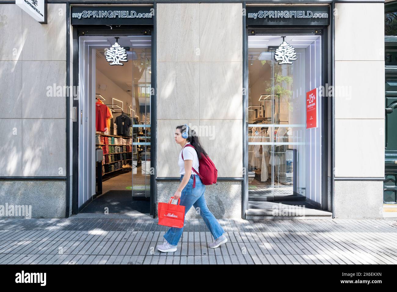 A woman walks past the Spanish fashion retailer brand owned by Tendam ...