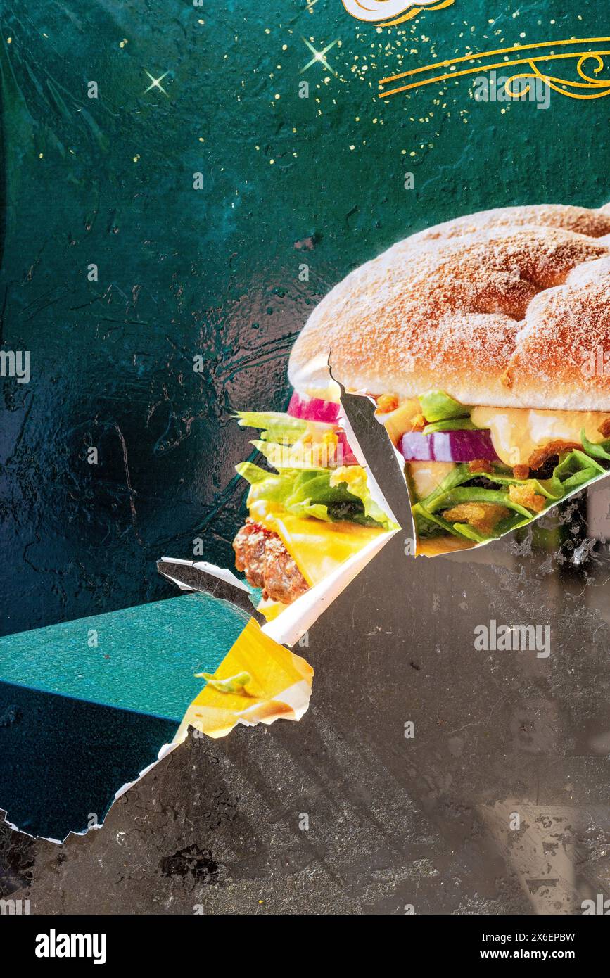 Abstract of torn and ripped advert for a brand of cheeseburger Stock ...