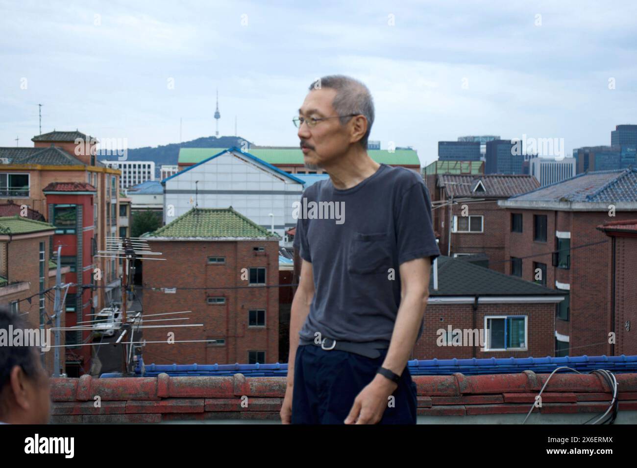 IN OUR DAY, director HONG Sang-soo, on set, 2023. © The Cinema Guild ...
