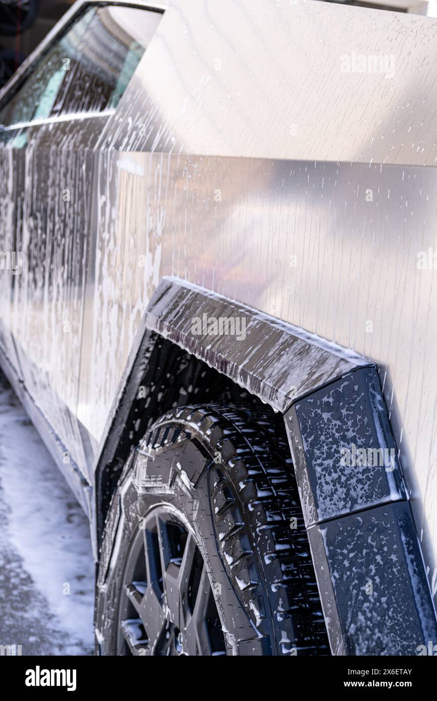 Close-up of Tesla Cybertruck Wheel and Body Covered in Soap Stock Photo ...