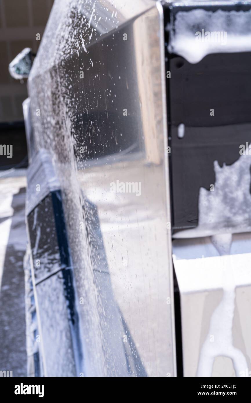 Soap Suds Dripping from the Edge of Tesla Cybertruck Window Stock Photo ...