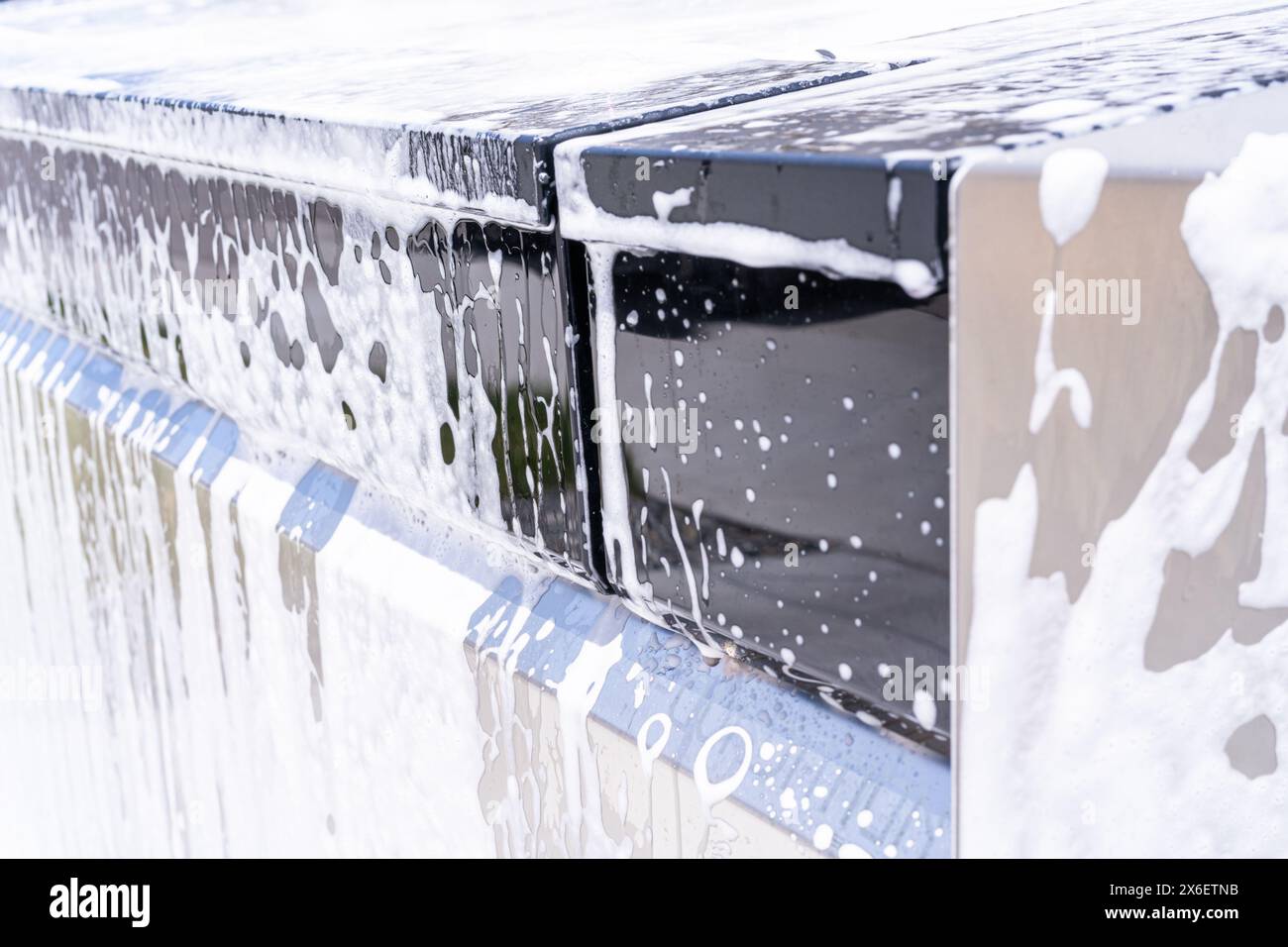 Soap Suds Dripping from the Edge of Tesla Cybertruck Window Stock Photo ...