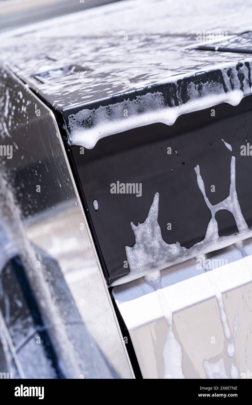 Soap Suds Dripping from the Edge of Tesla Cybertruck Window Stock Photo ...