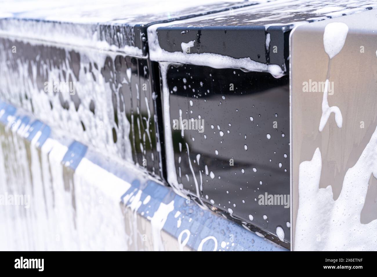Soap Suds Dripping from the Edge of Tesla Cybertruck Window Stock Photo ...